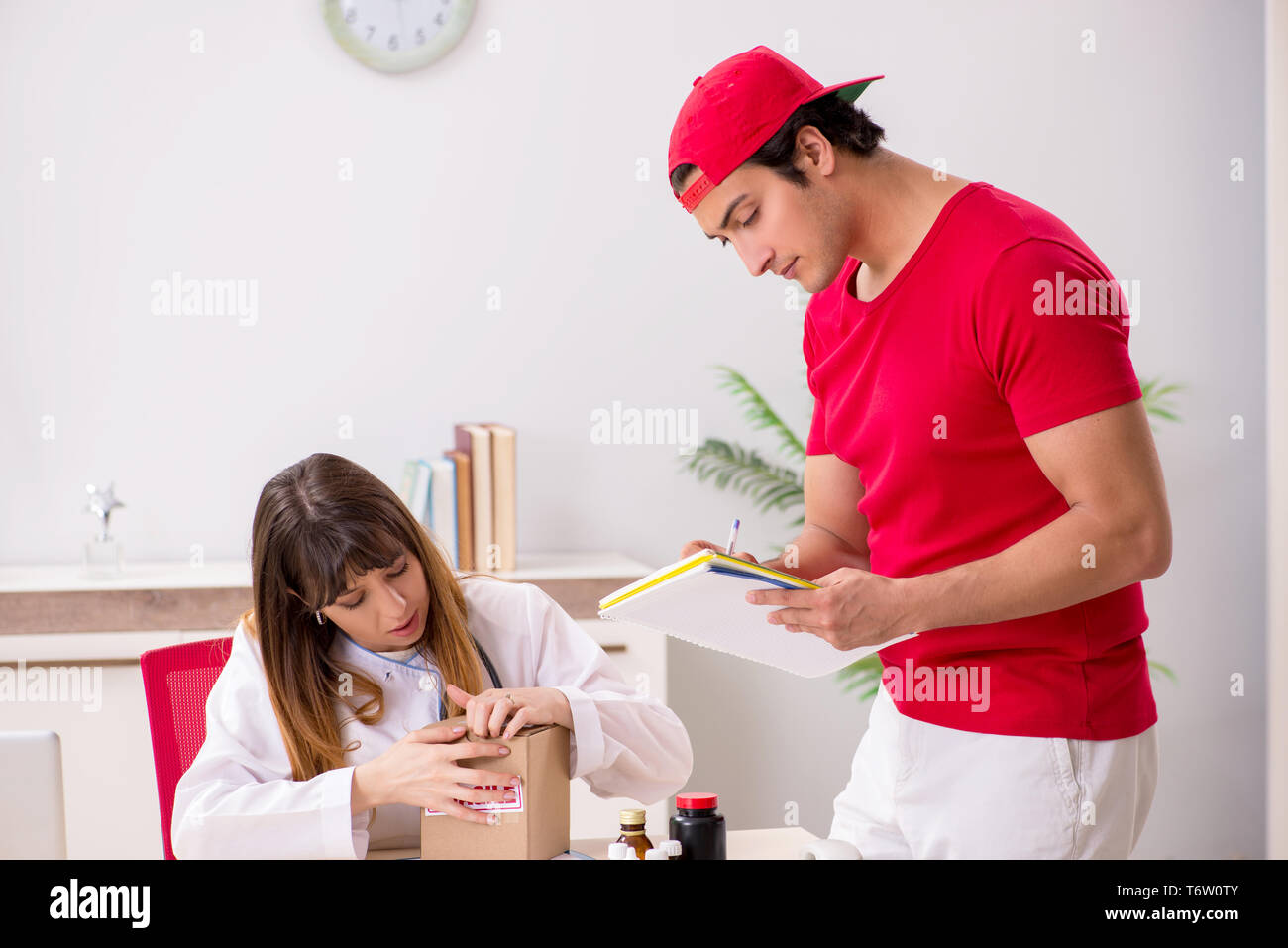 Woman delivering medicines hi-res stock photography and images - Alamy
