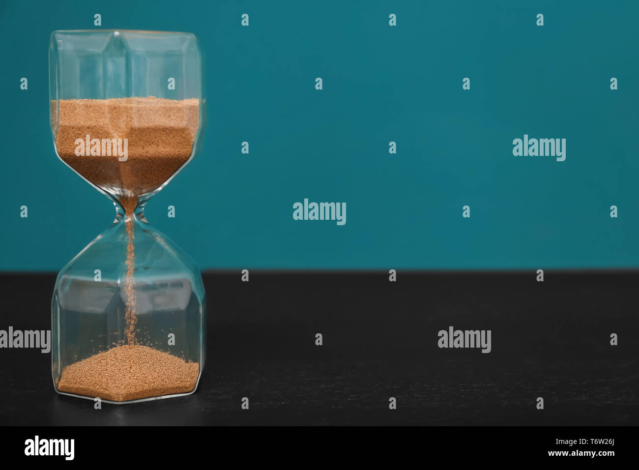 Hourglass on color background. Time management concept Stock Photo - Alamy