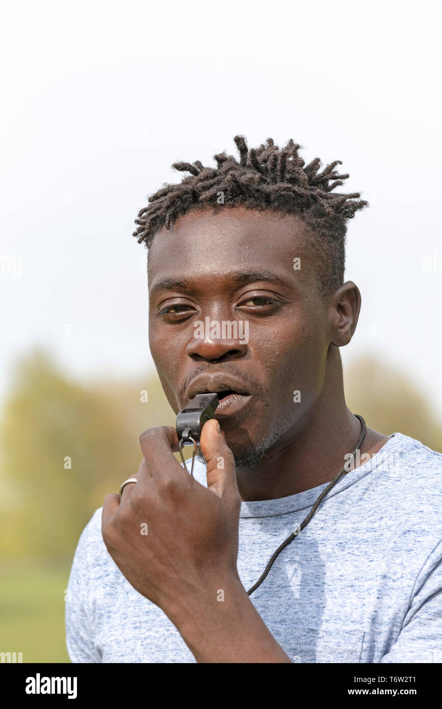 England, UK, circa 2019. Portrait of a referee or coach about to blow a ...
