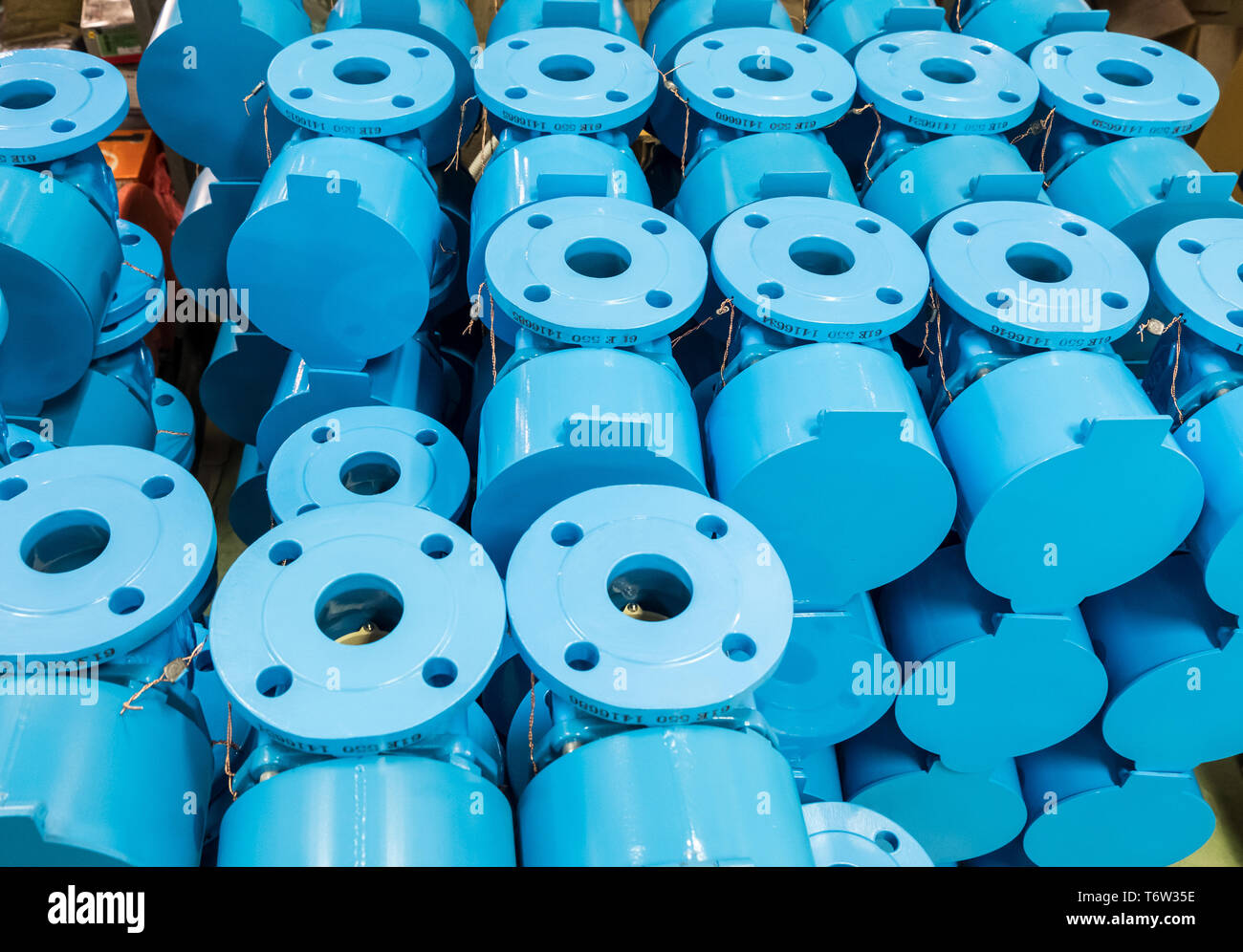 Metal base of the master water meter are stacking in the factory for ...