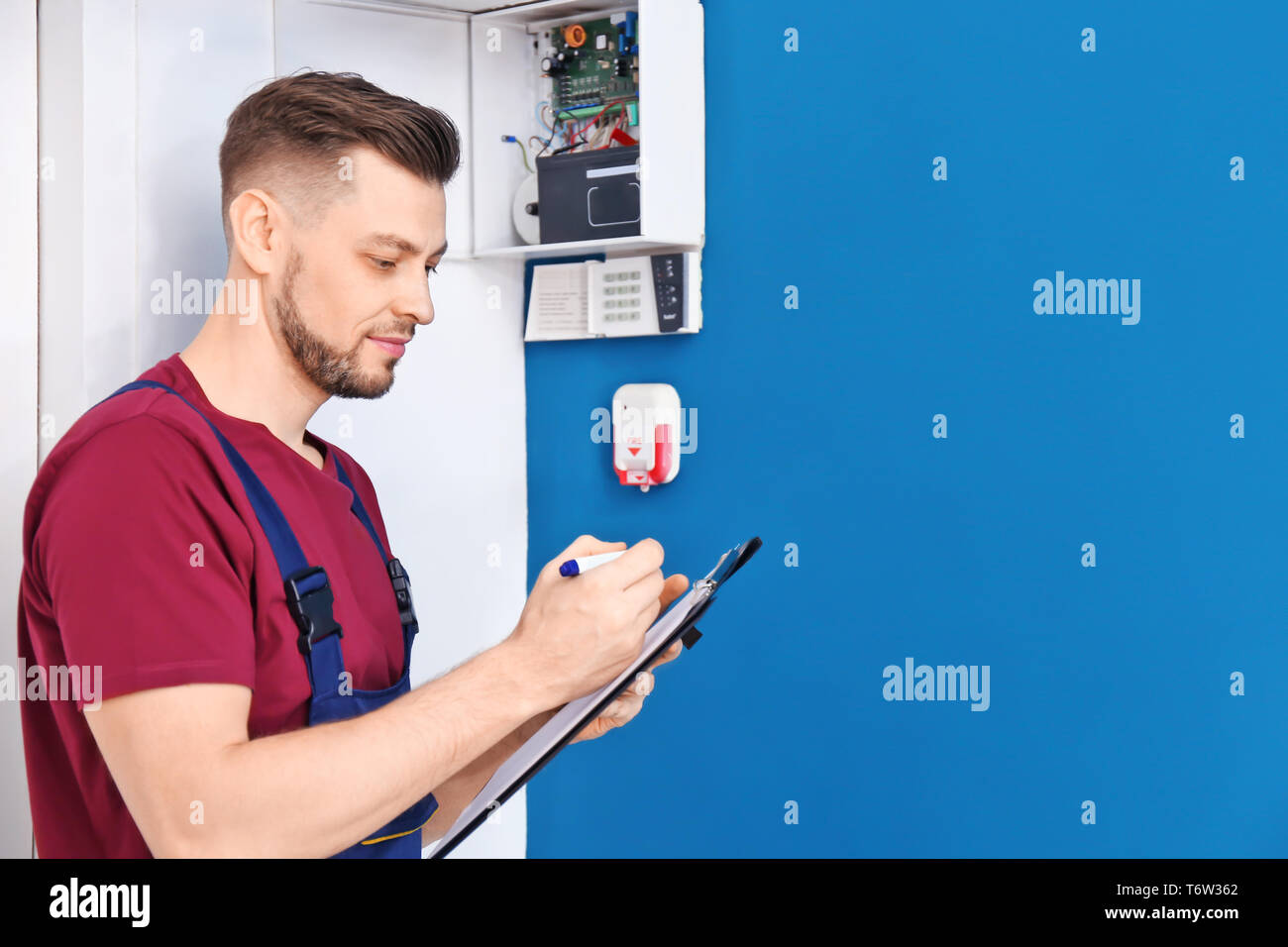 Worker inspecting control panel hi-res stock photography and images - Alamy
