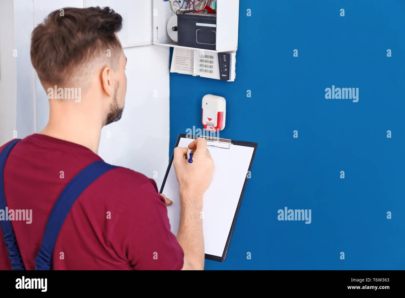 Worker inspecting control panel hi-res stock photography and images - Alamy