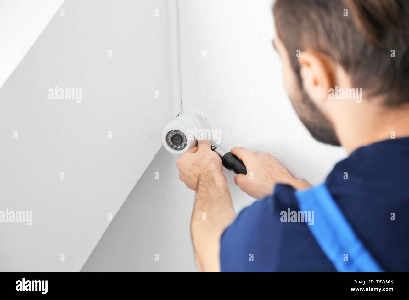 Technician inspecting camera sensor hi-res stock photography and images ...