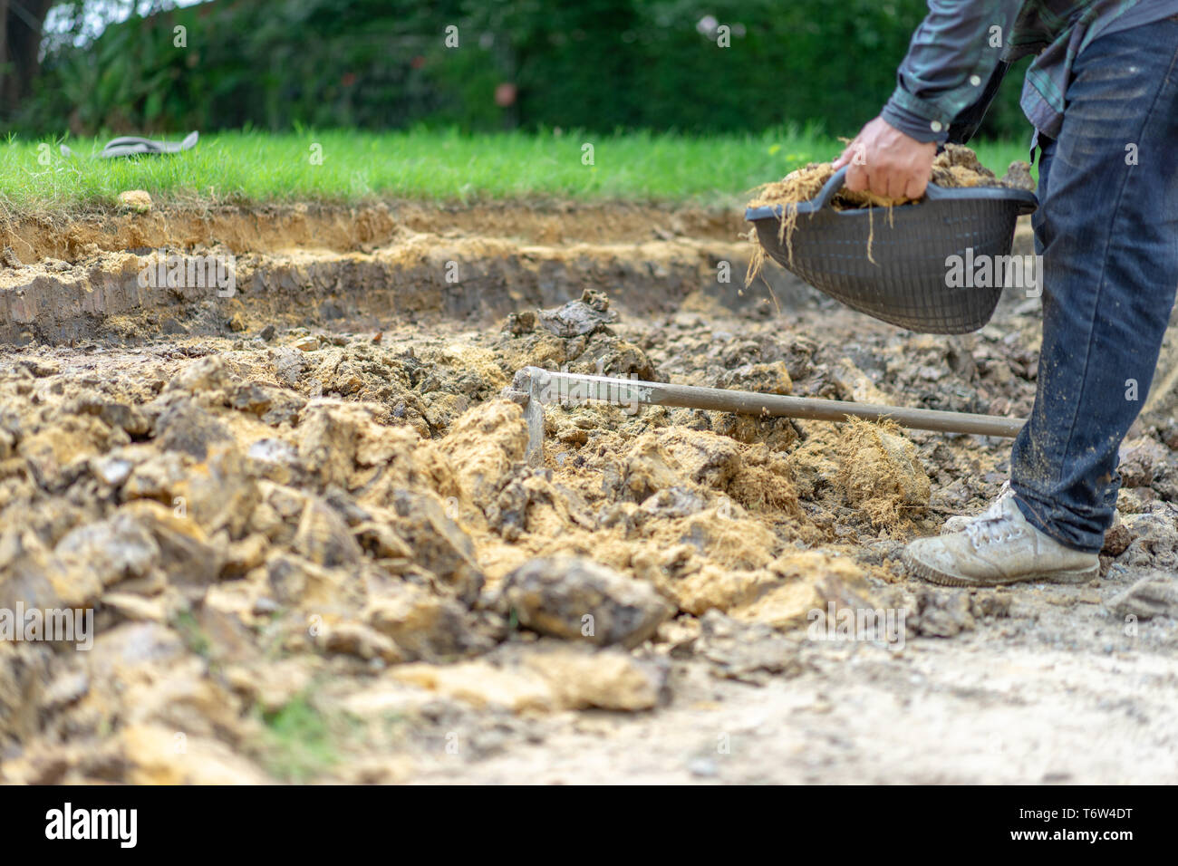 Man digging clay garden hi-res stock photography and images - Alamy