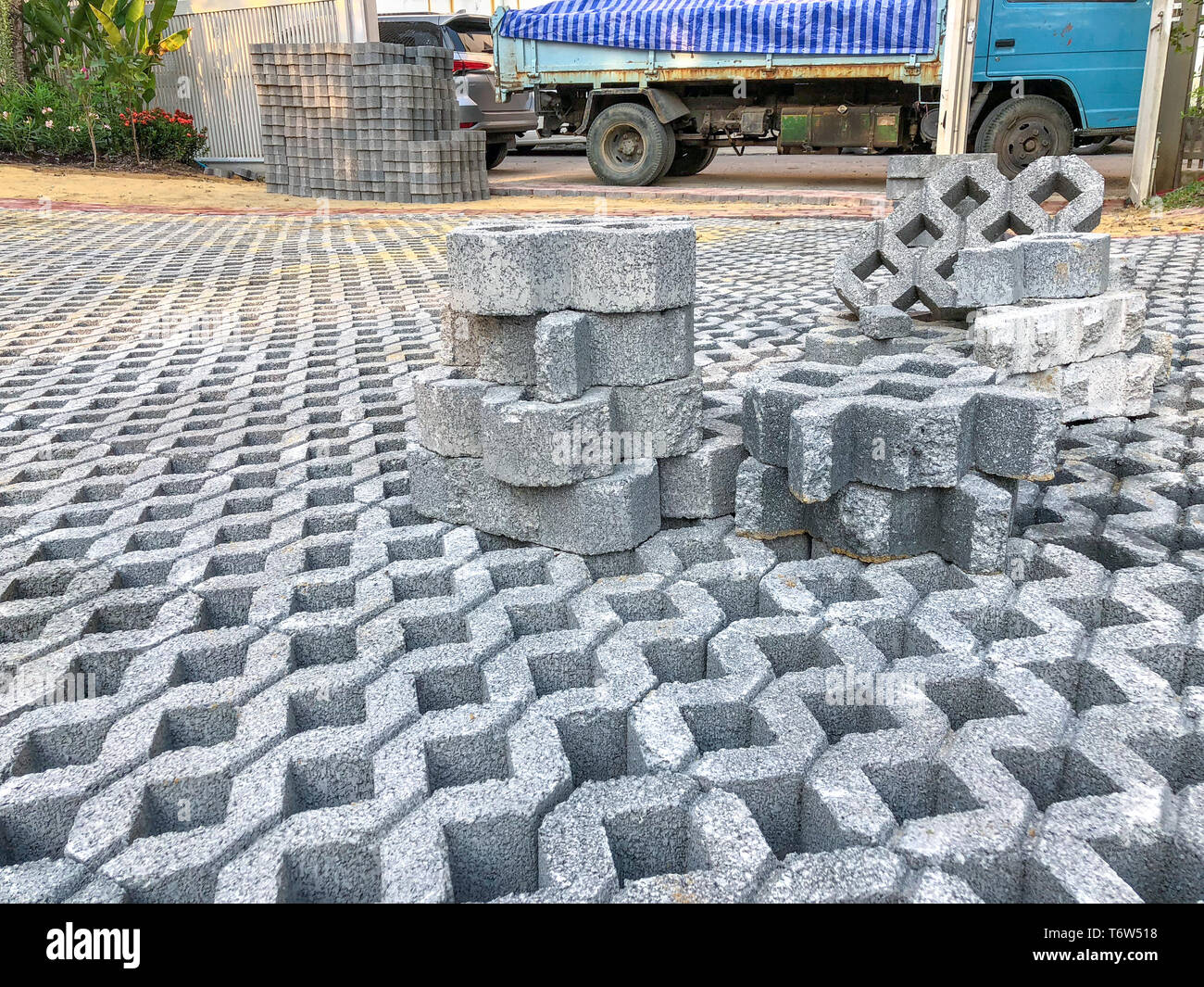 gray color stone brick block floor tile with green grass and sand as ...