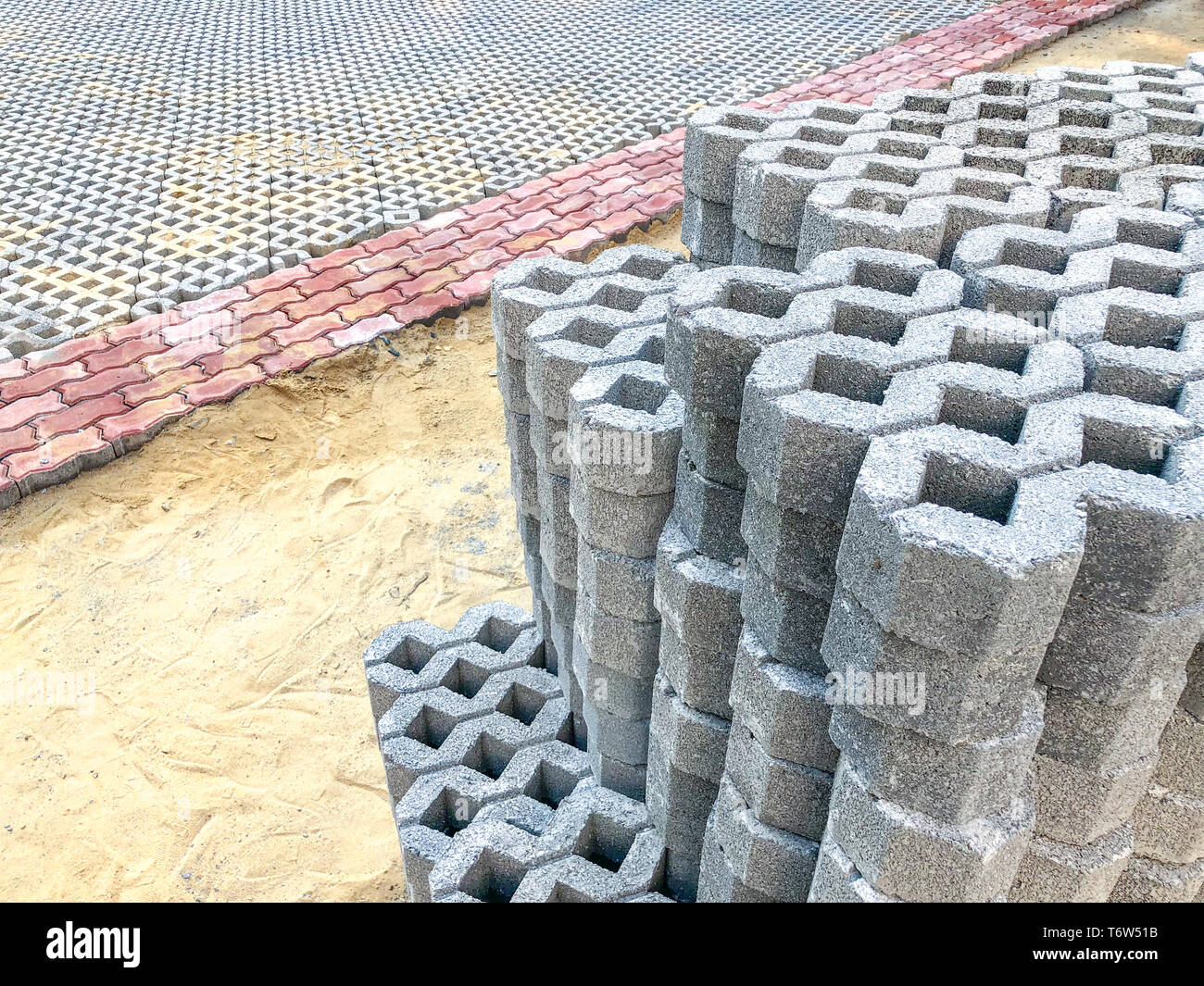 gray color stone brick block floor tile with green grass and sand as ...