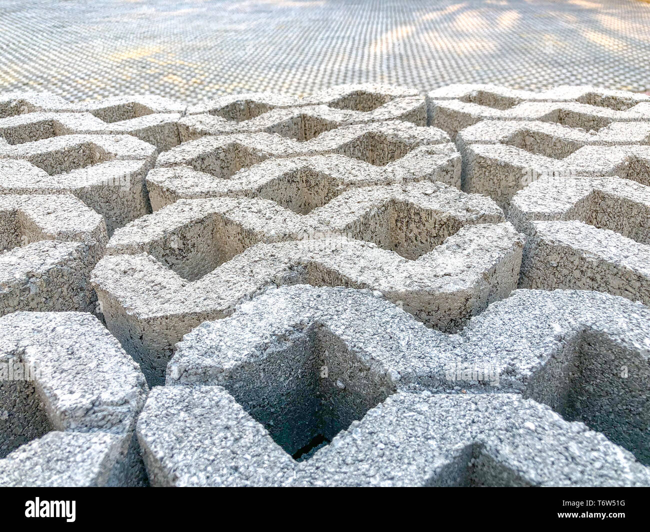 gray color stone brick block floor tile with green grass and sand as ...