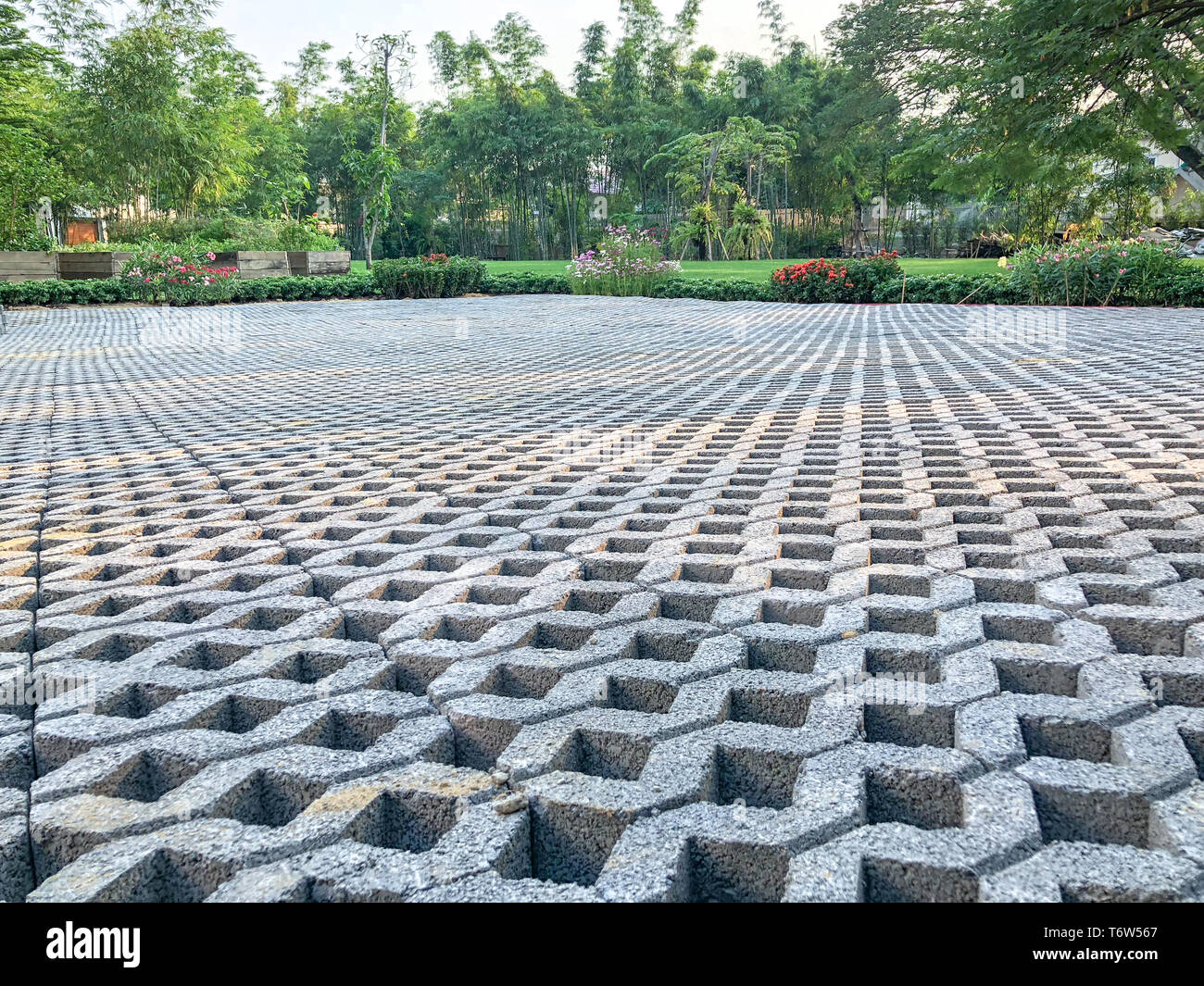 gray color stone brick block floor tile with green grass and sand as ...