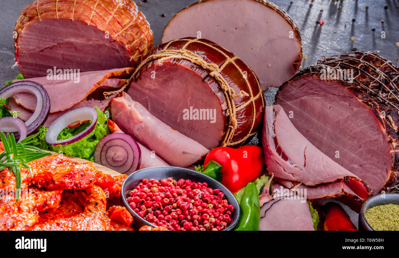 Composition with assorted meat products including ham Stock Photo - Alamy