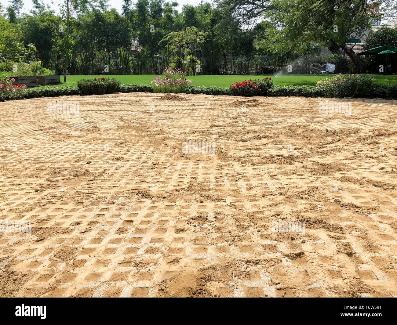 gray color stone brick block floor tile with green grass and sand as ...