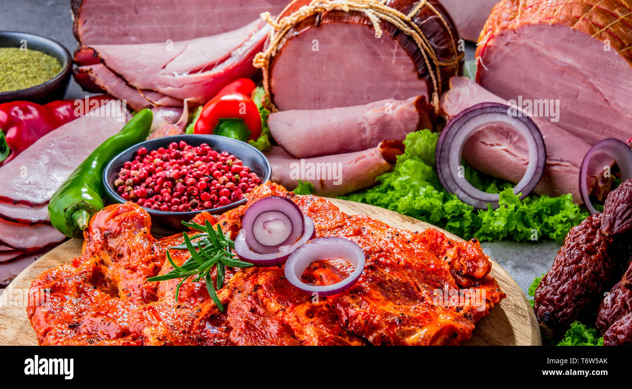 Composition with assorted meat products including ham Stock Photo - Alamy