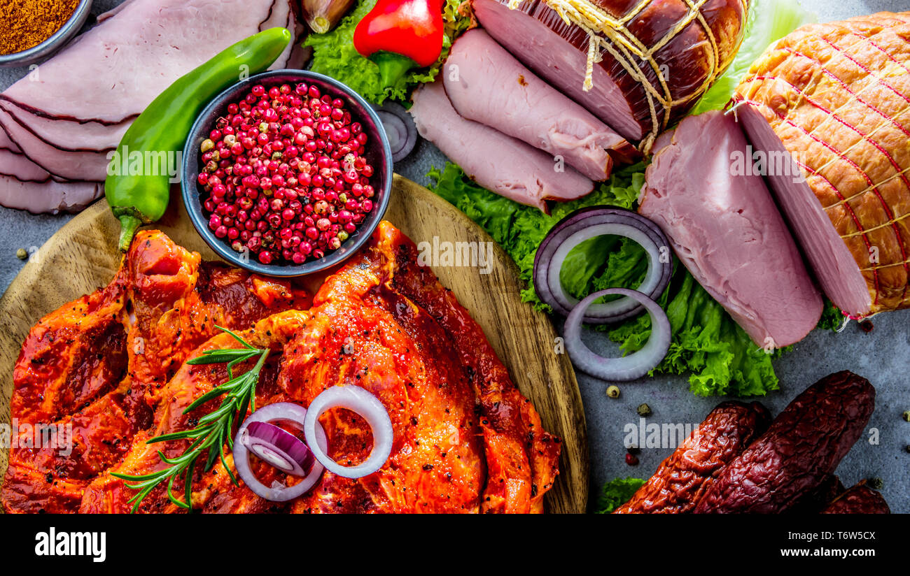 Composition with assorted meat products including ham Stock Photo - Alamy