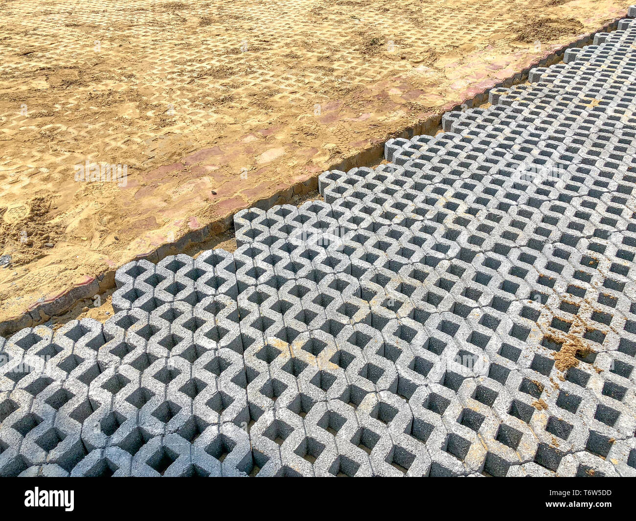 gray color stone brick block floor tile with green grass and sand as ...