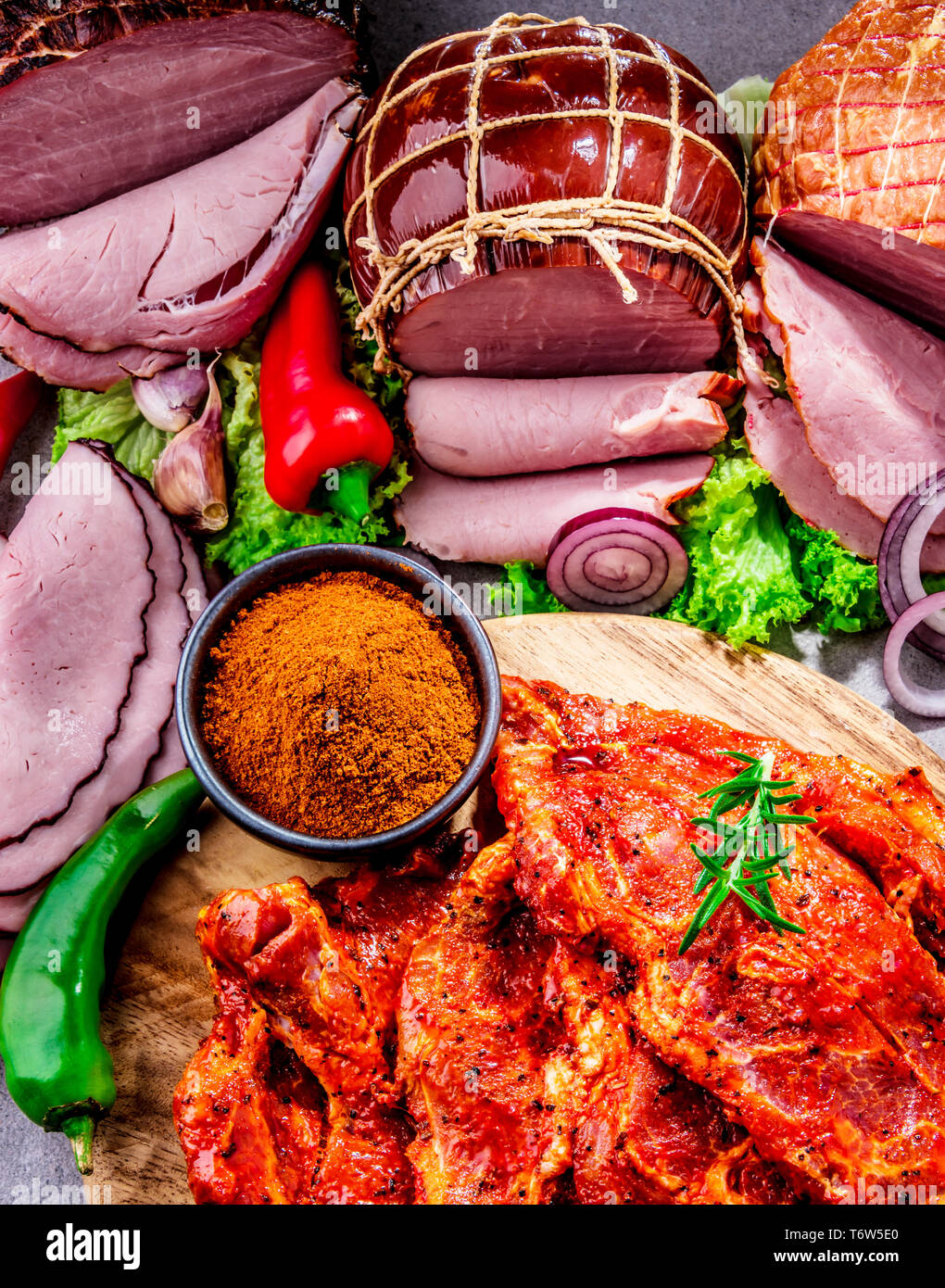 Composition with assorted meat products including ham Stock Photo - Alamy