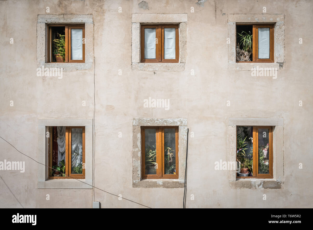 Old building with six windows facade Stock Photo - Alamy