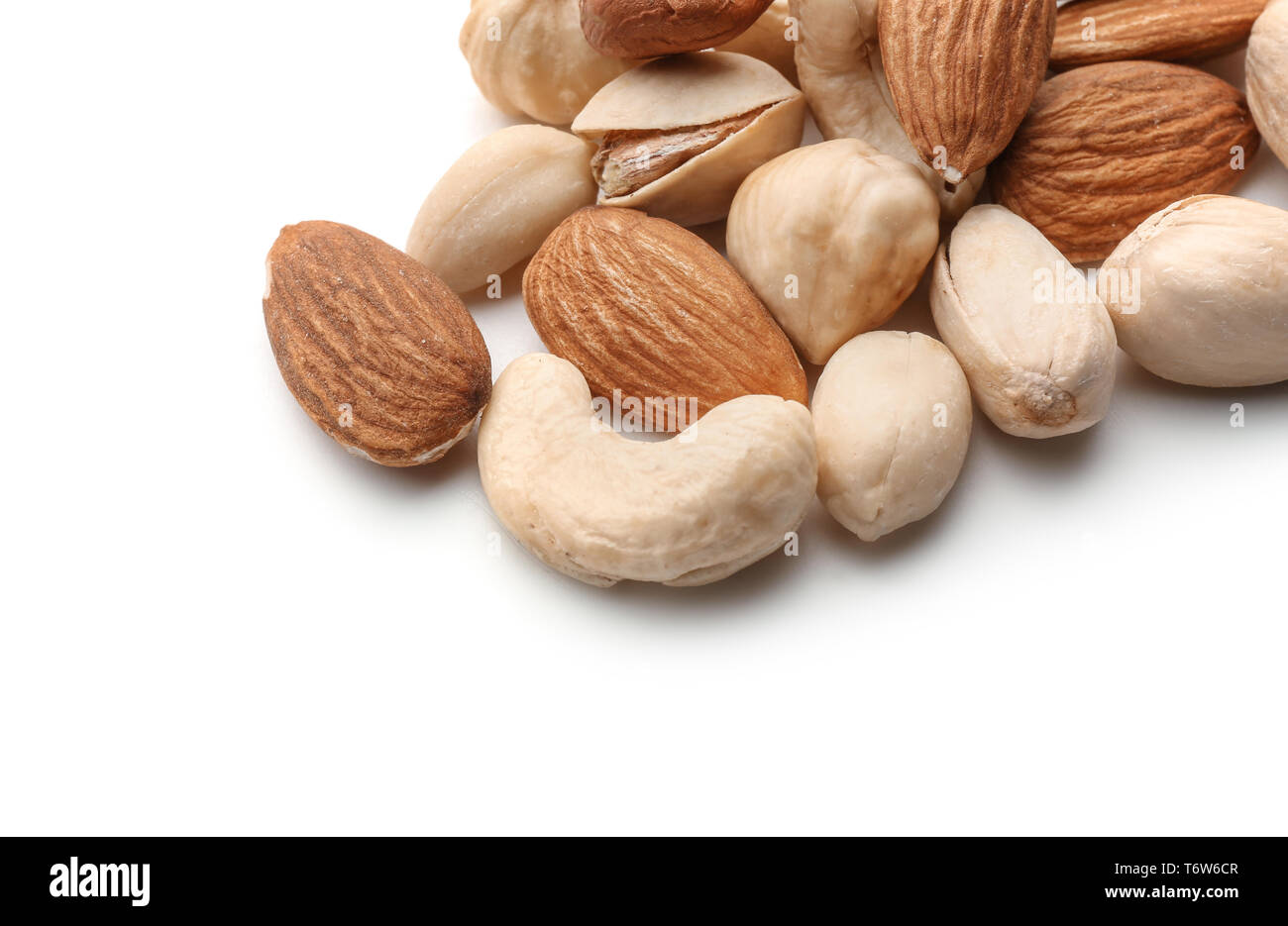Different types of nuts on white background Stock Photo - Alamy