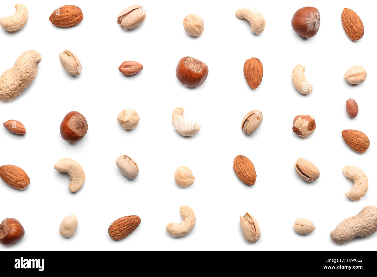 Different types of nuts on white background Stock Photo - Alamy