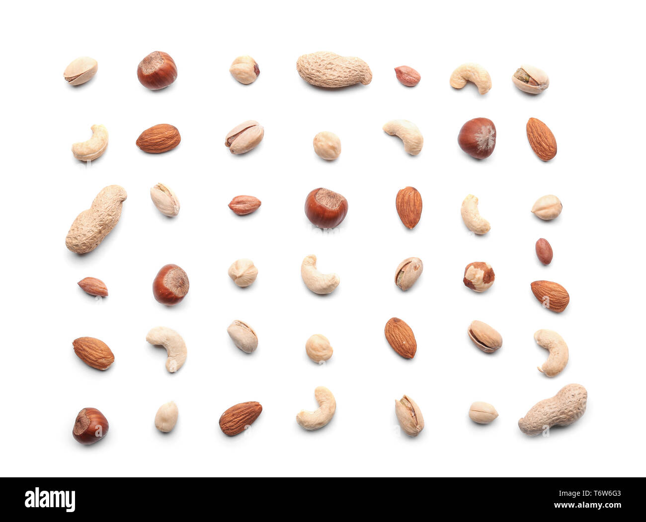 Different types of nuts on white background Stock Photo - Alamy