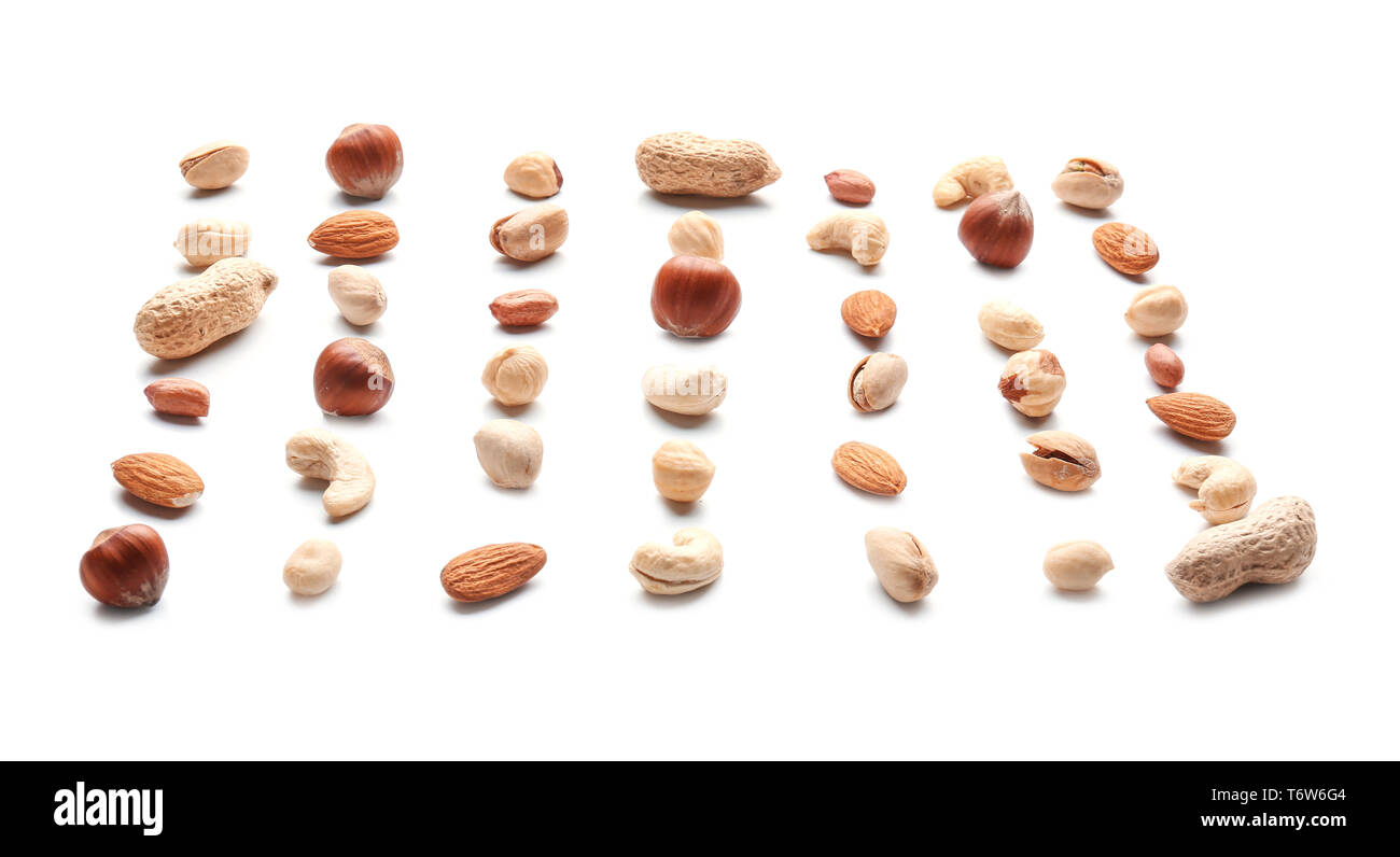 Different types of nuts on white background Stock Photo - Alamy