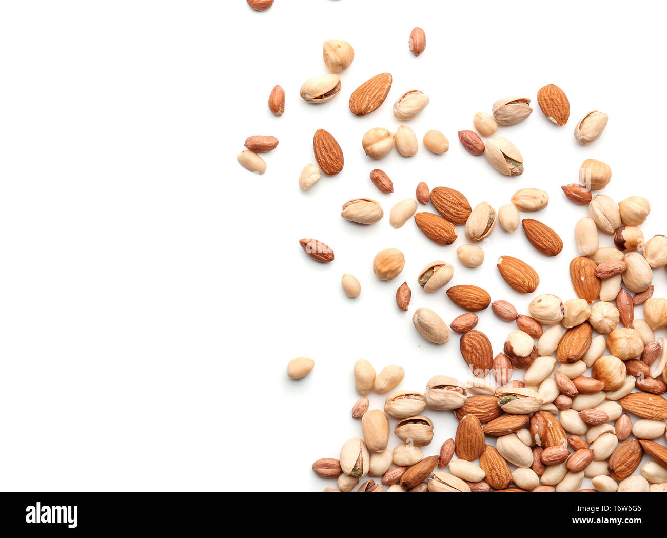 Different types of nuts on white background Stock Photo - Alamy