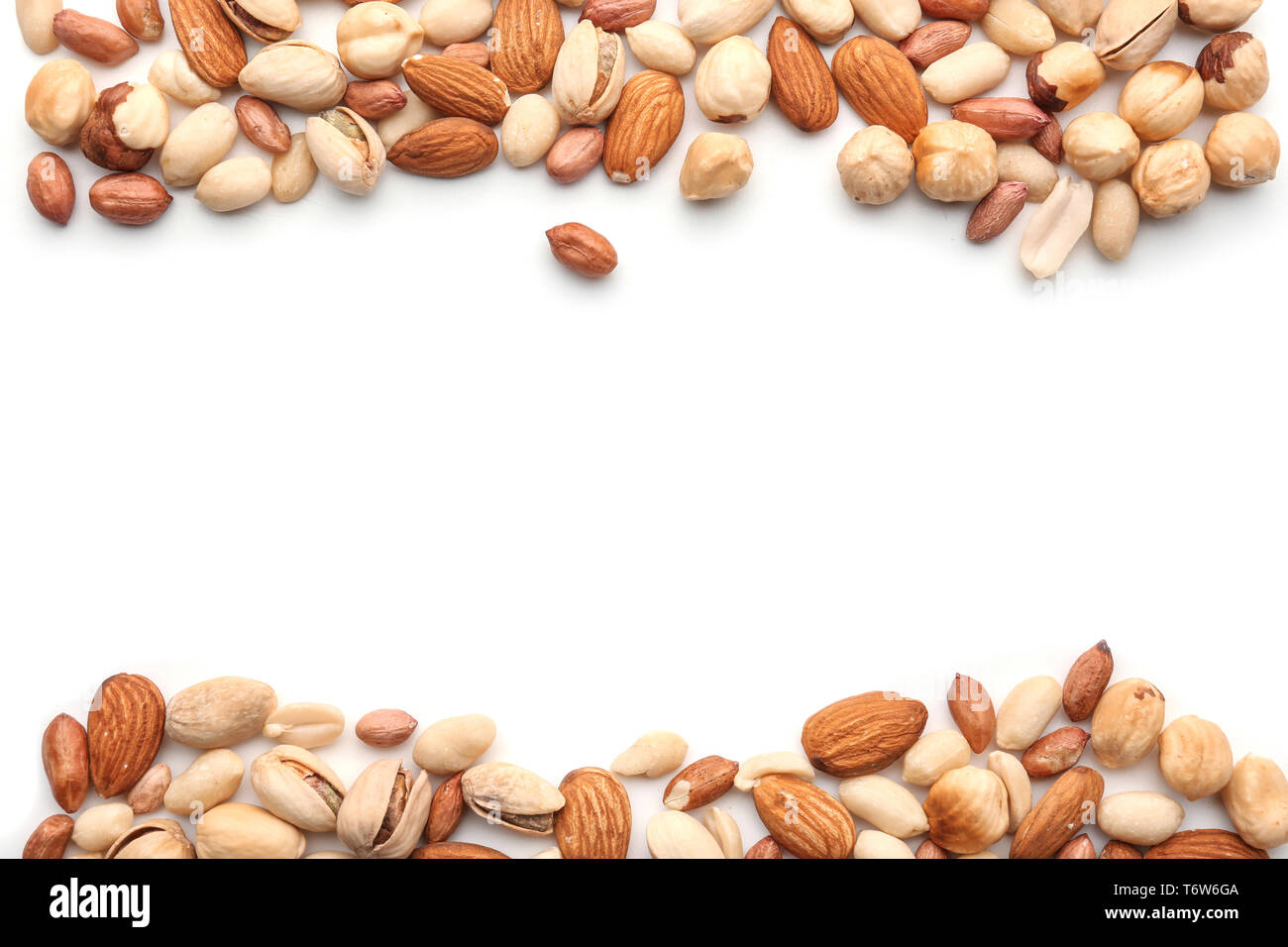 Different types of nuts on white background Stock Photo - Alamy