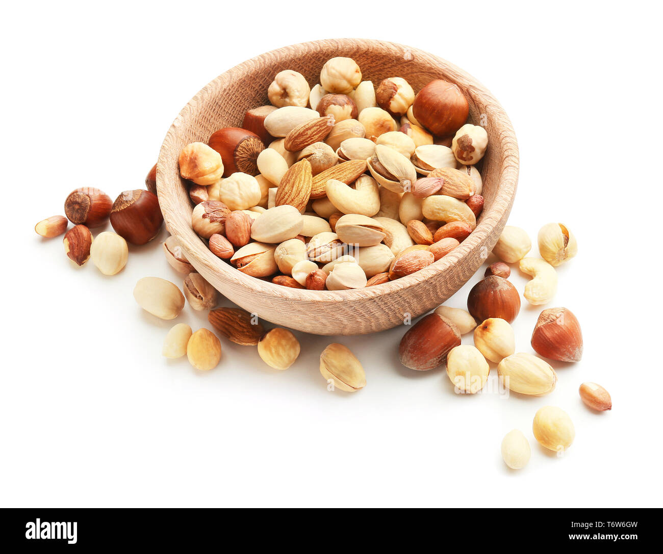 Different nuts in bowl on white background Stock Photo - Alamy