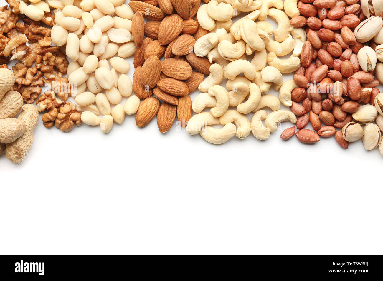 Different types of nuts on white background Stock Photo - Alamy