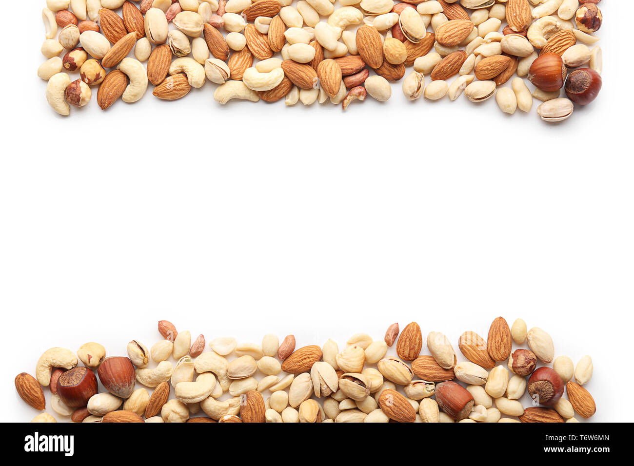 Different types of nuts on white background Stock Photo - Alamy