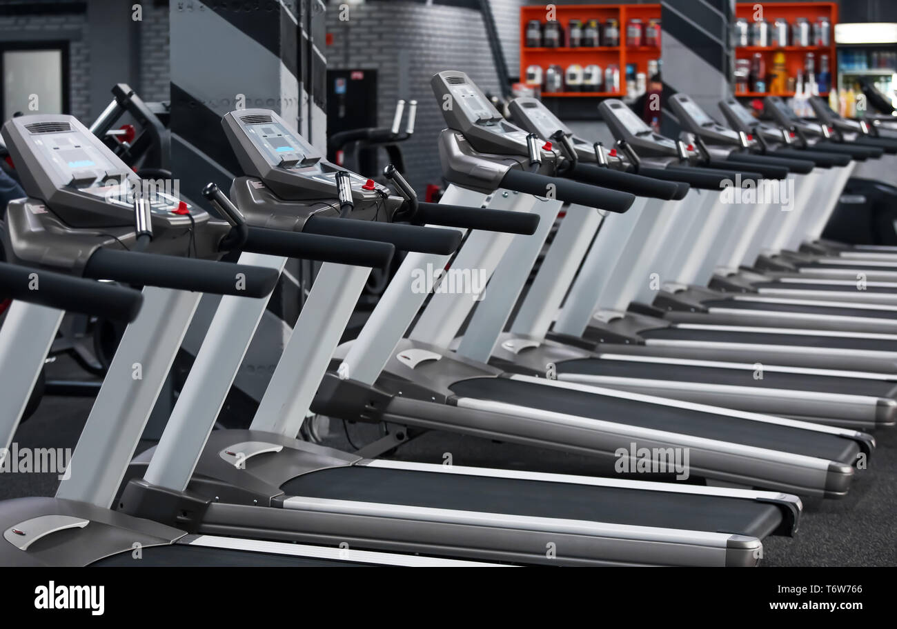 Modern treadmills in gym Stock Photo - Alamy