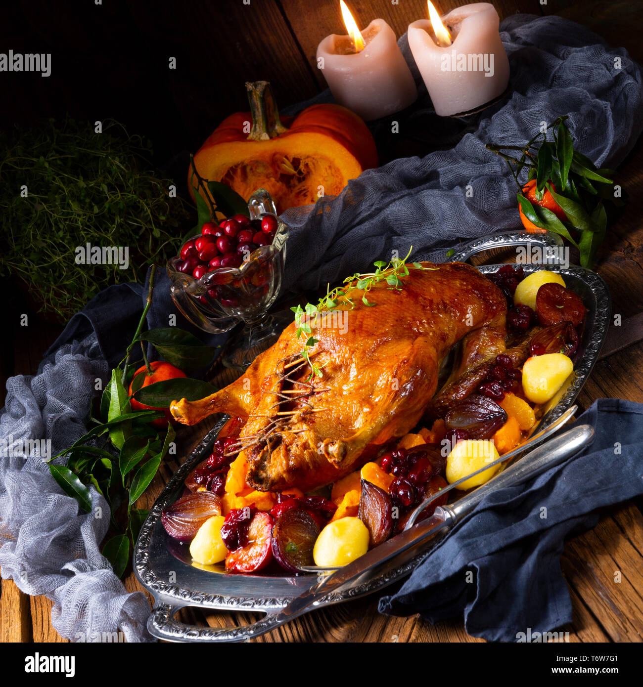 Tasty Duck roasted with thyme and Apple Stock Photo - Alamy