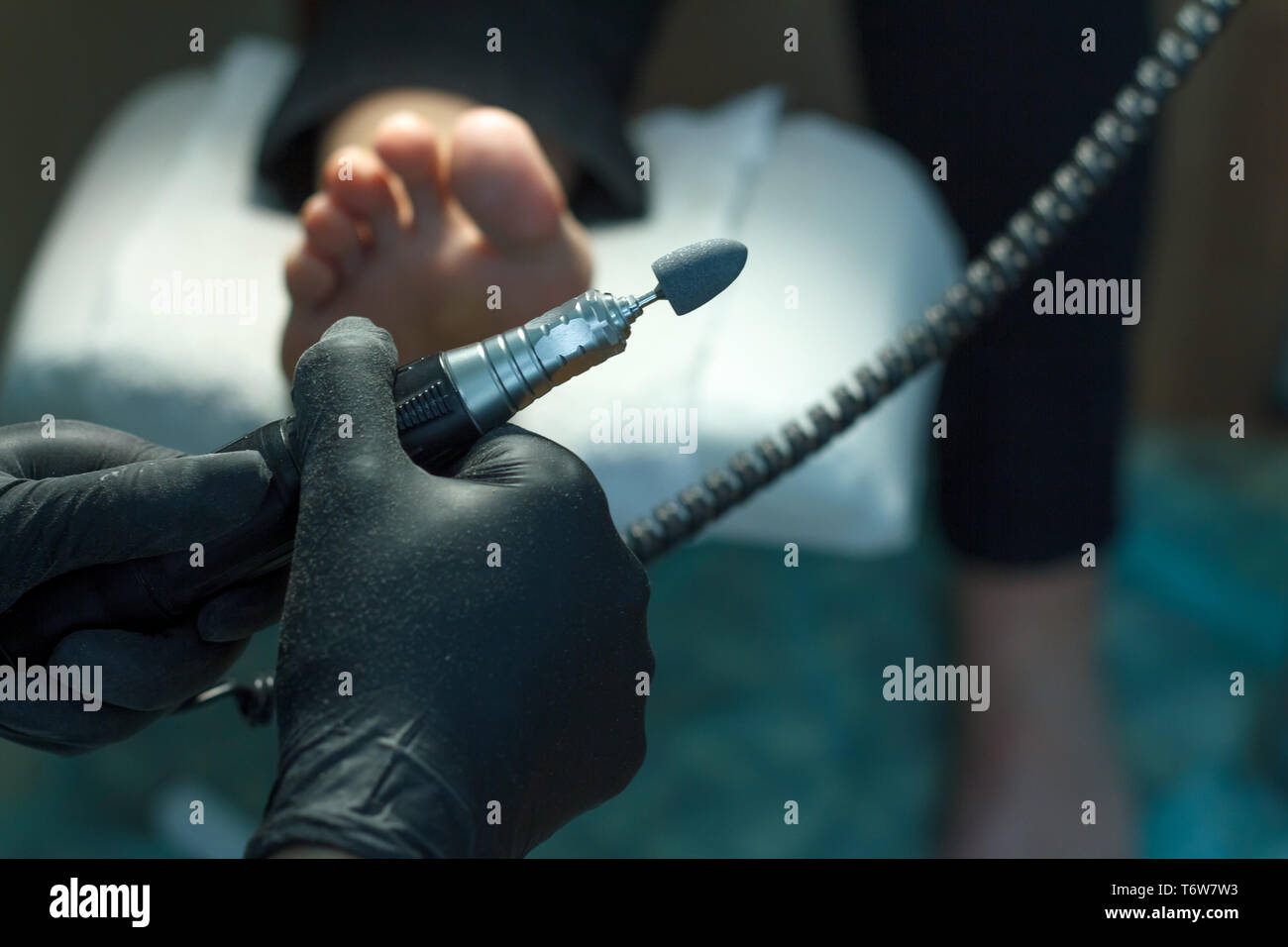 Professional hardware pedicure using electric machine.Patient on ...