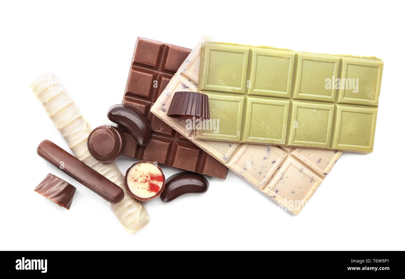 Different chocolate bars and candies on white background Stock Photo ...