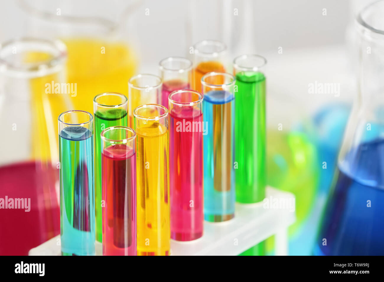 Test tubes with colorful liquids in rack, closeup Stock Photo - Alamy