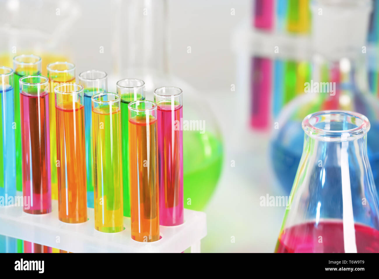 Test tubes with colorful liquids in rack, closeup Stock Photo - Alamy