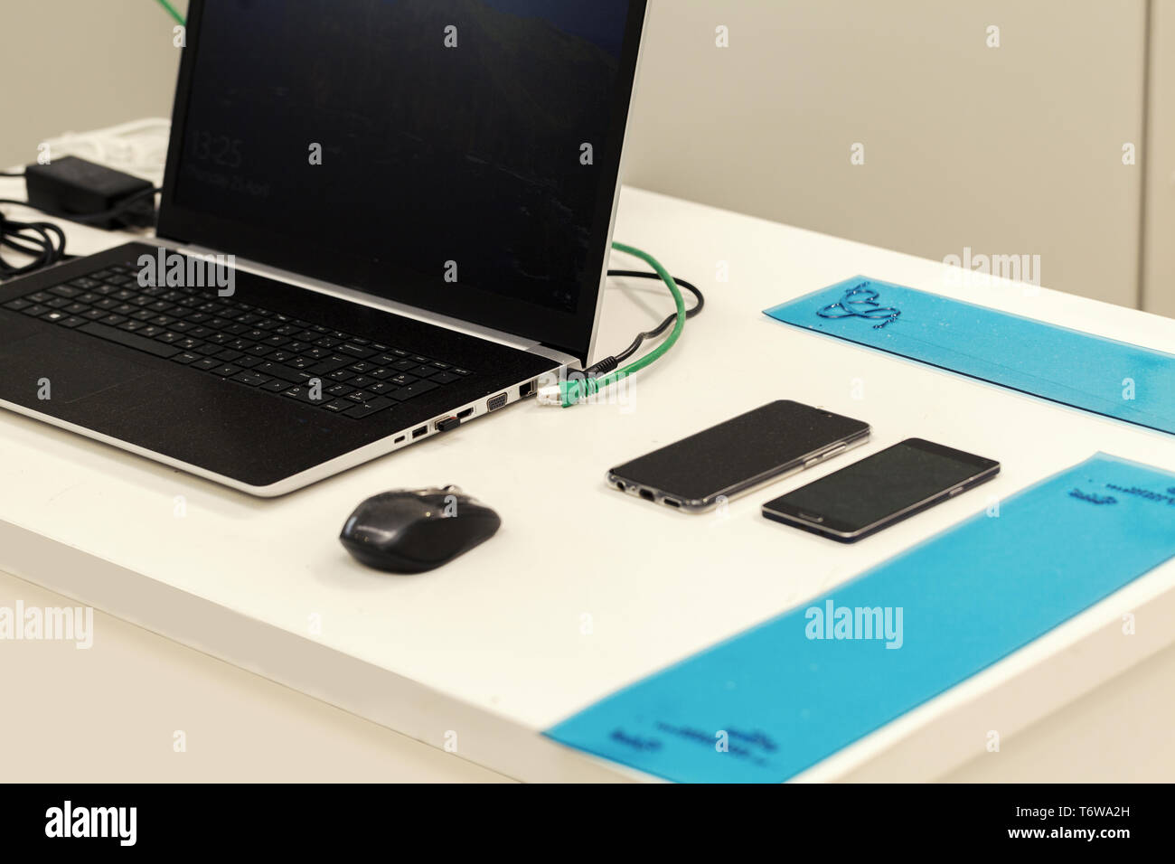 working table with laptop and mobil phones, close up Stock Photo - Alamy