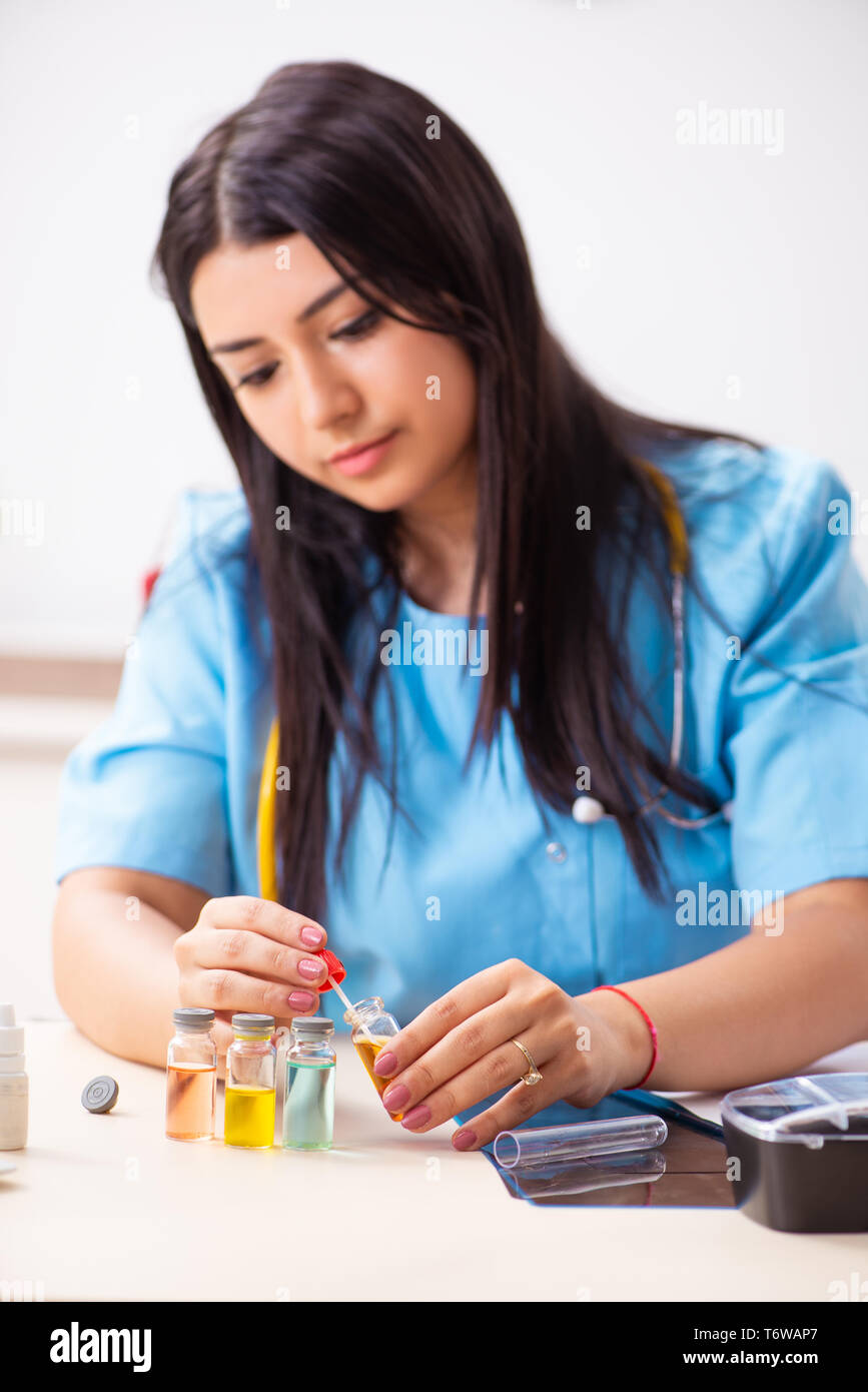 Young beautiful female doctor working in the clinic Stock Photo - Alamy