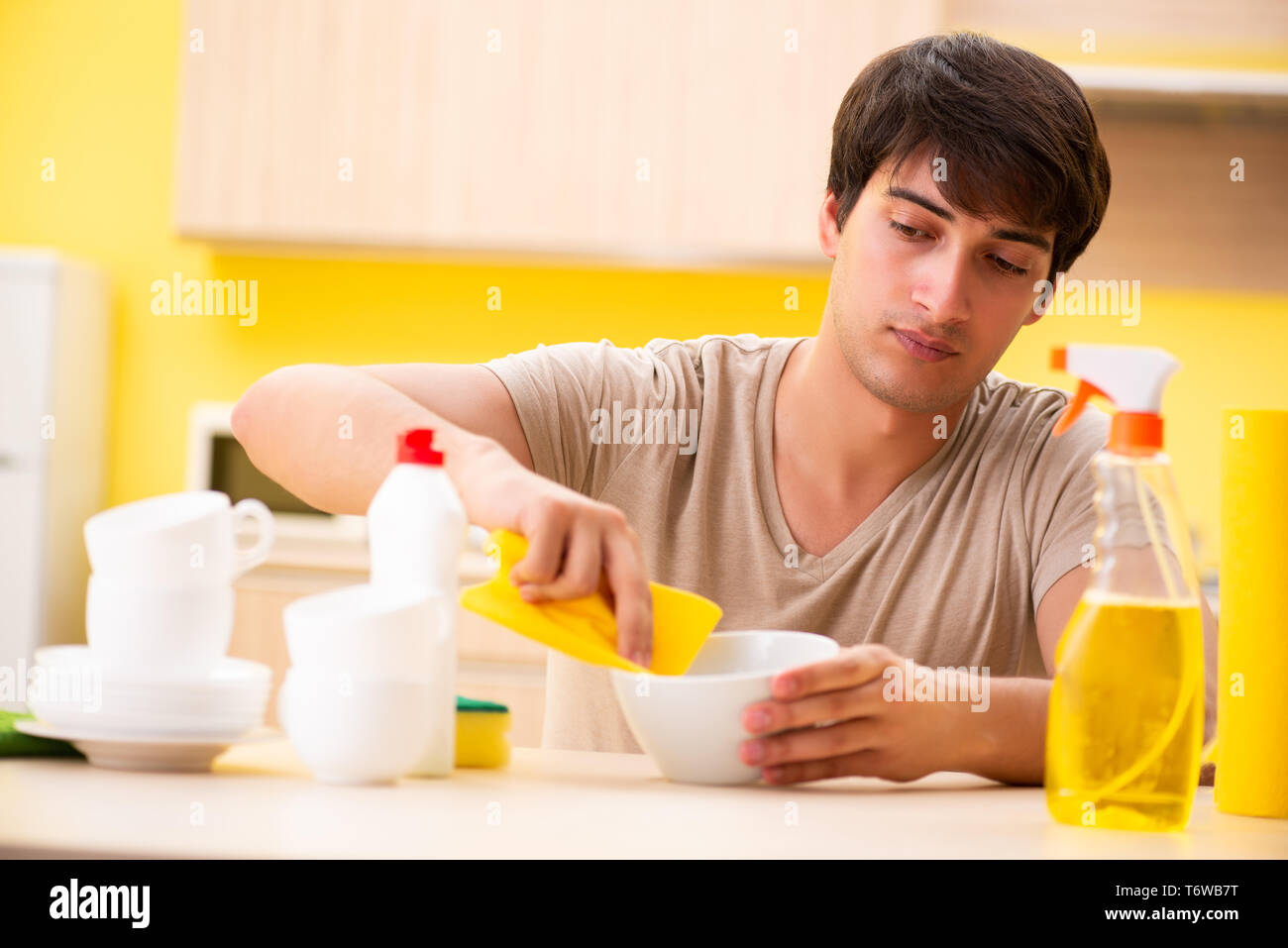 Man washing dishes at home Stock Photo - Alamy