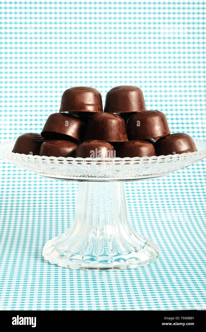 chocolate pralines on a glass stand Stock Photo - Alamy