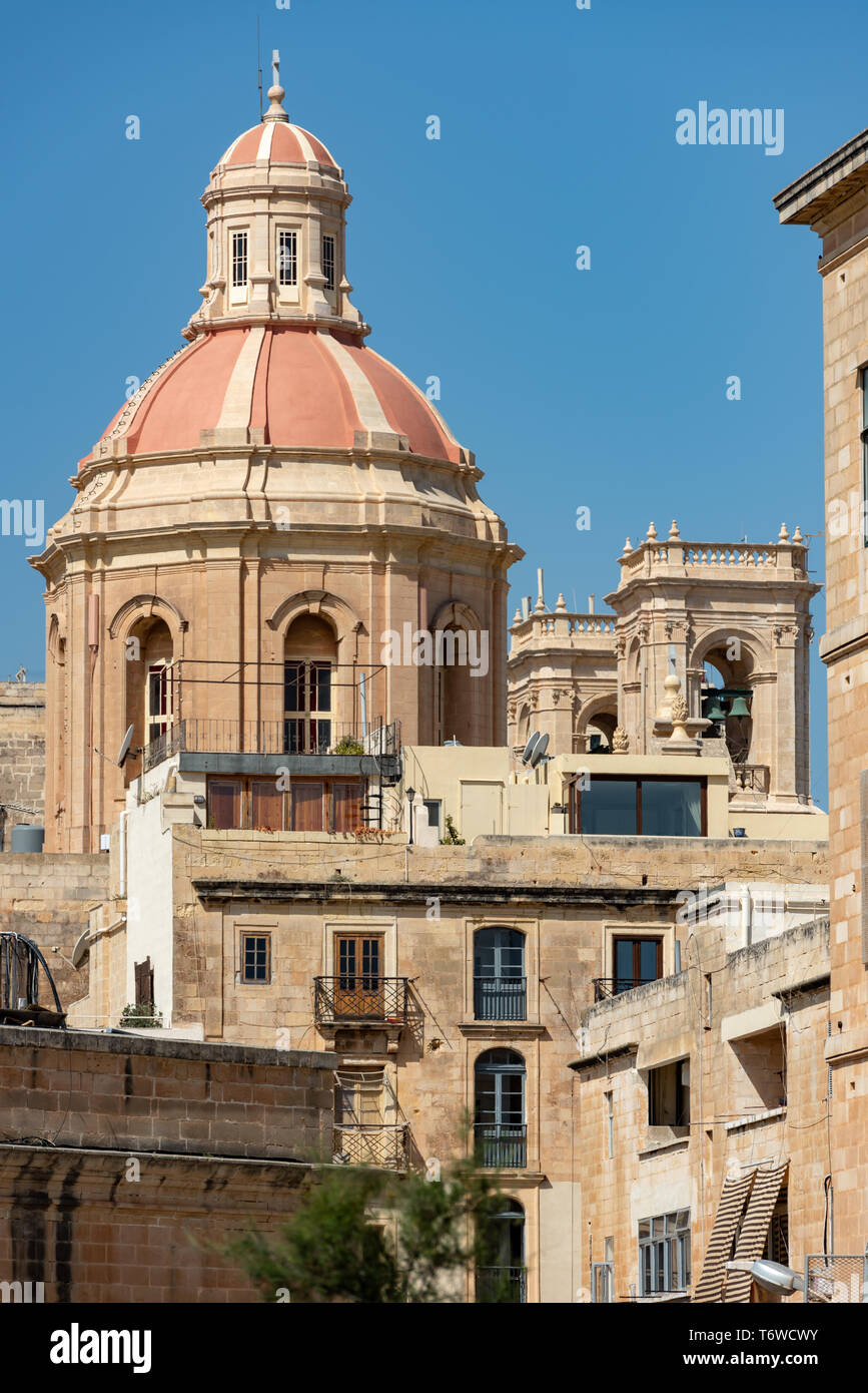 The ornate dome of St Nicholas' Church and bell towers of the Basilica ...