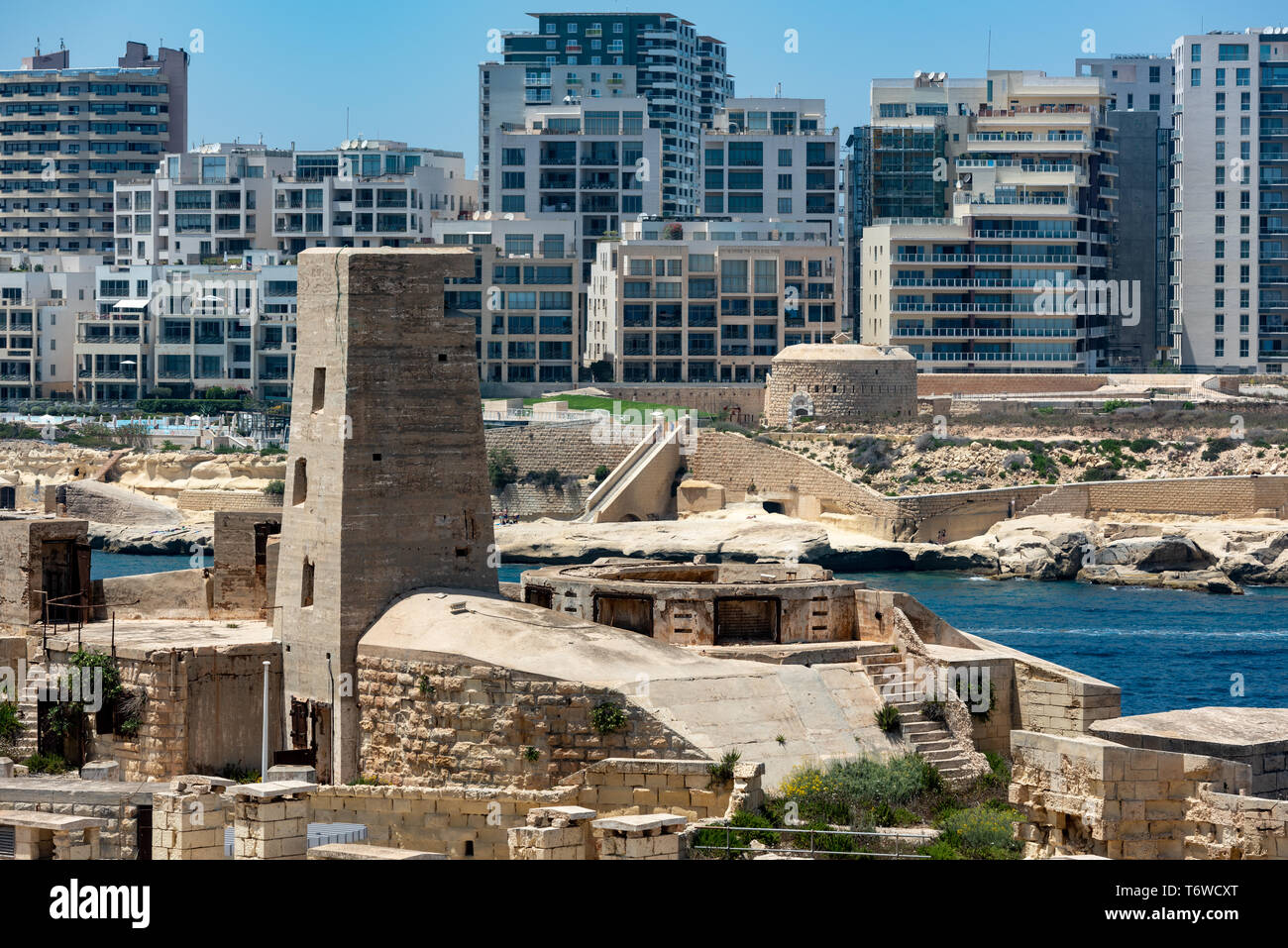 Historic and modern side by side in Malta. The limestone forts St Elmo ...