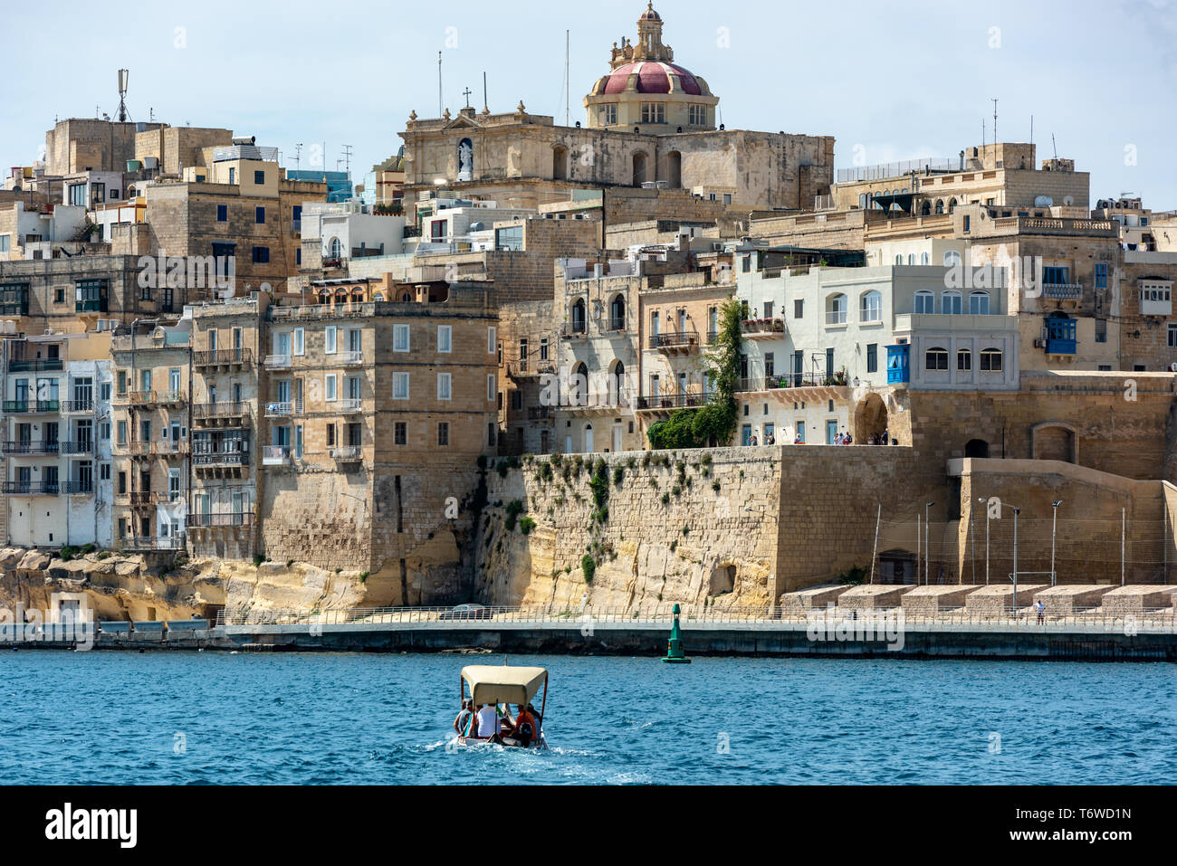 A Dghajsa tal-Pass, traditional Maltese boat, crossing the Grand ...