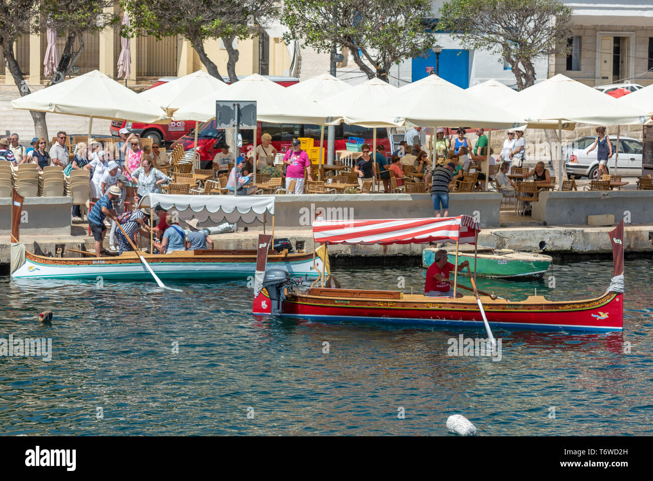 Colourful traditional Dghajsa tal-Pass water taxis await custom at the ...