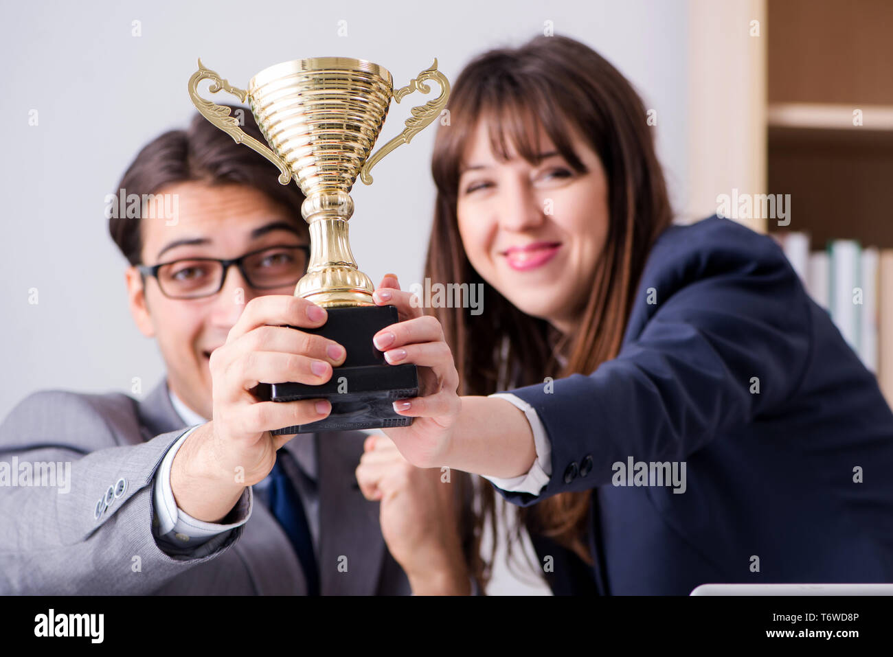 Concept of teamwork with prize Stock Photo - Alamy