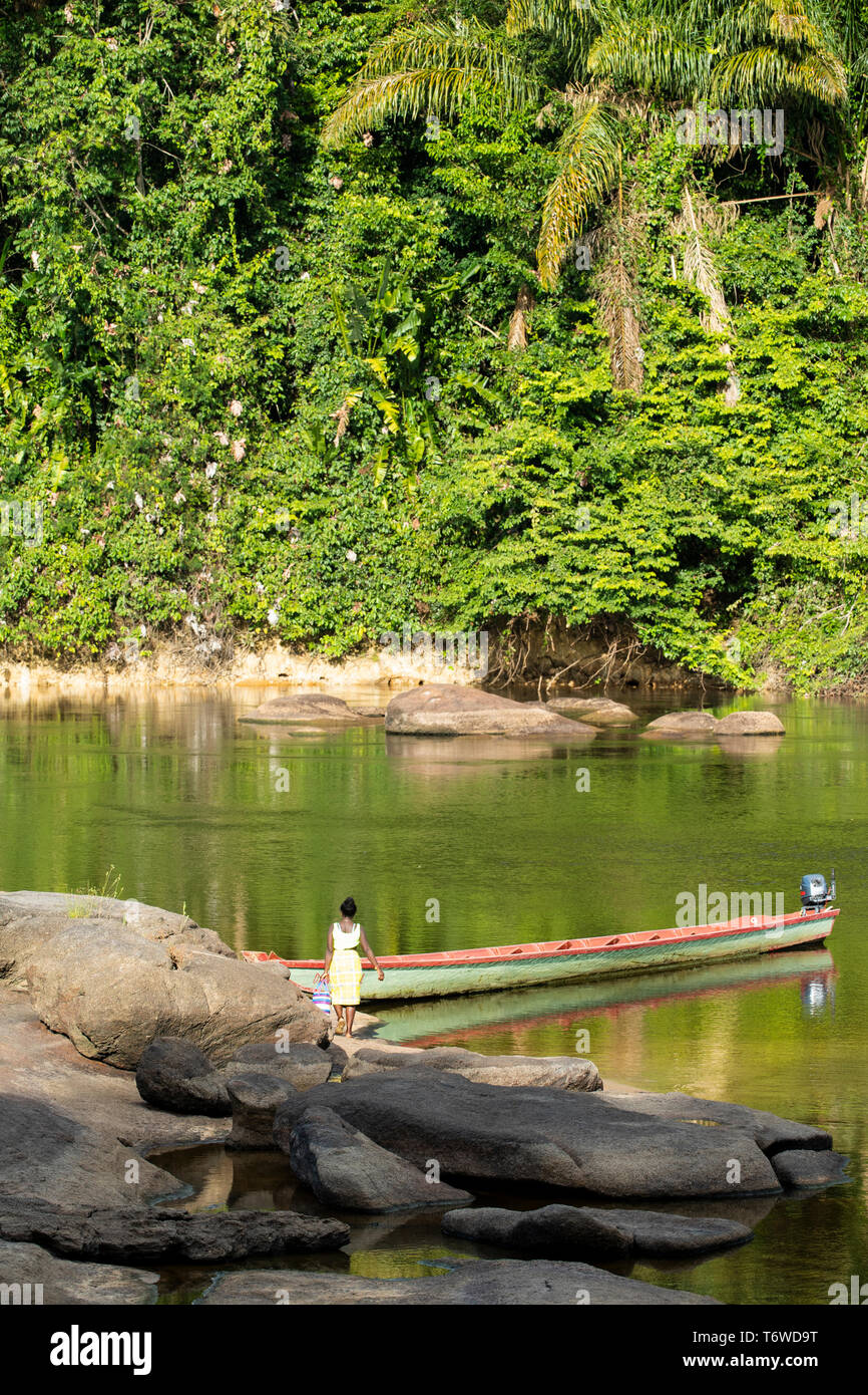Maroon woman with her boat, Upper Suriname River, Suriname Stock Photo ...