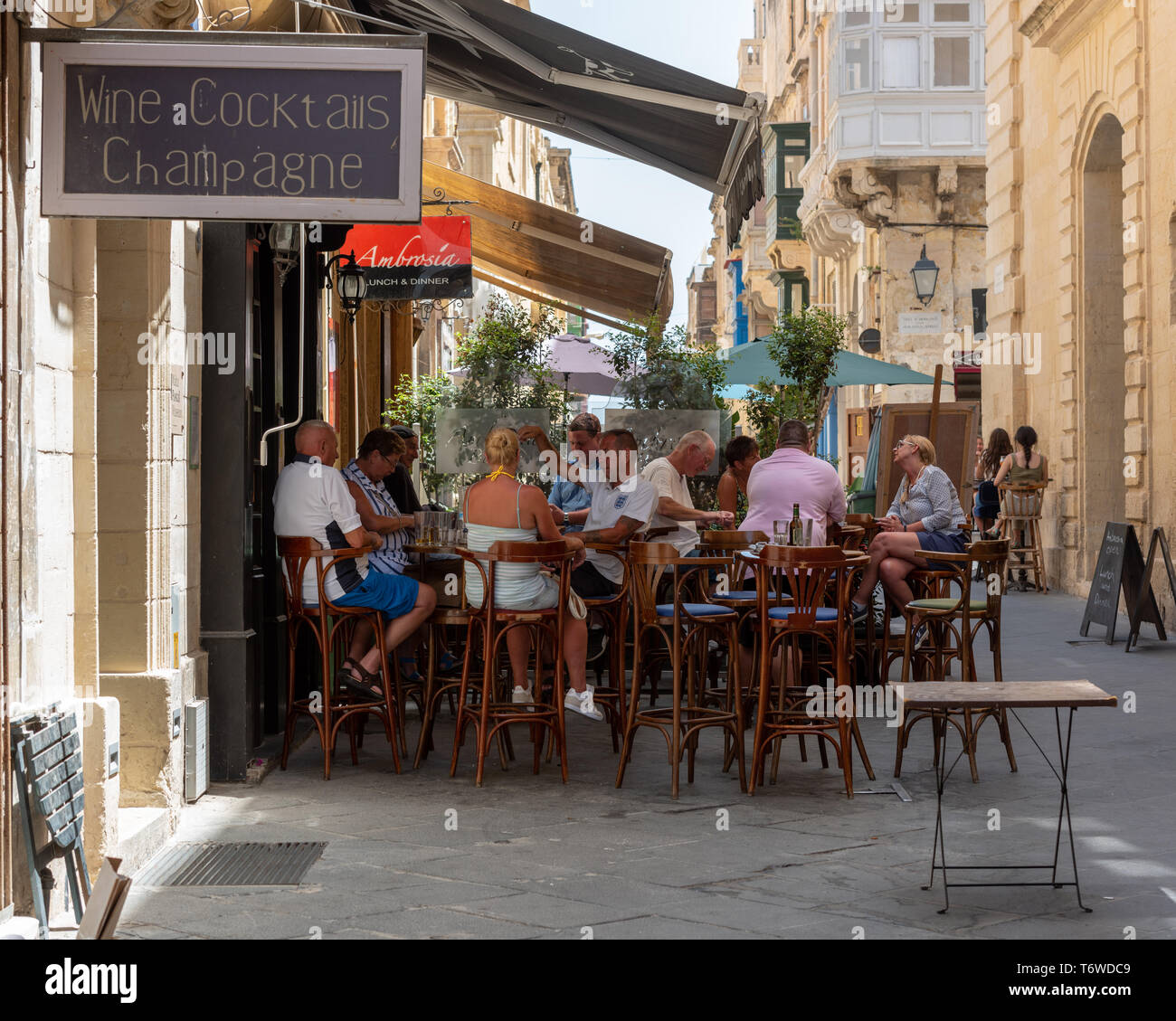 Friends gather for a shady, alfresco, lunchtime drink at the Ambrosia ...