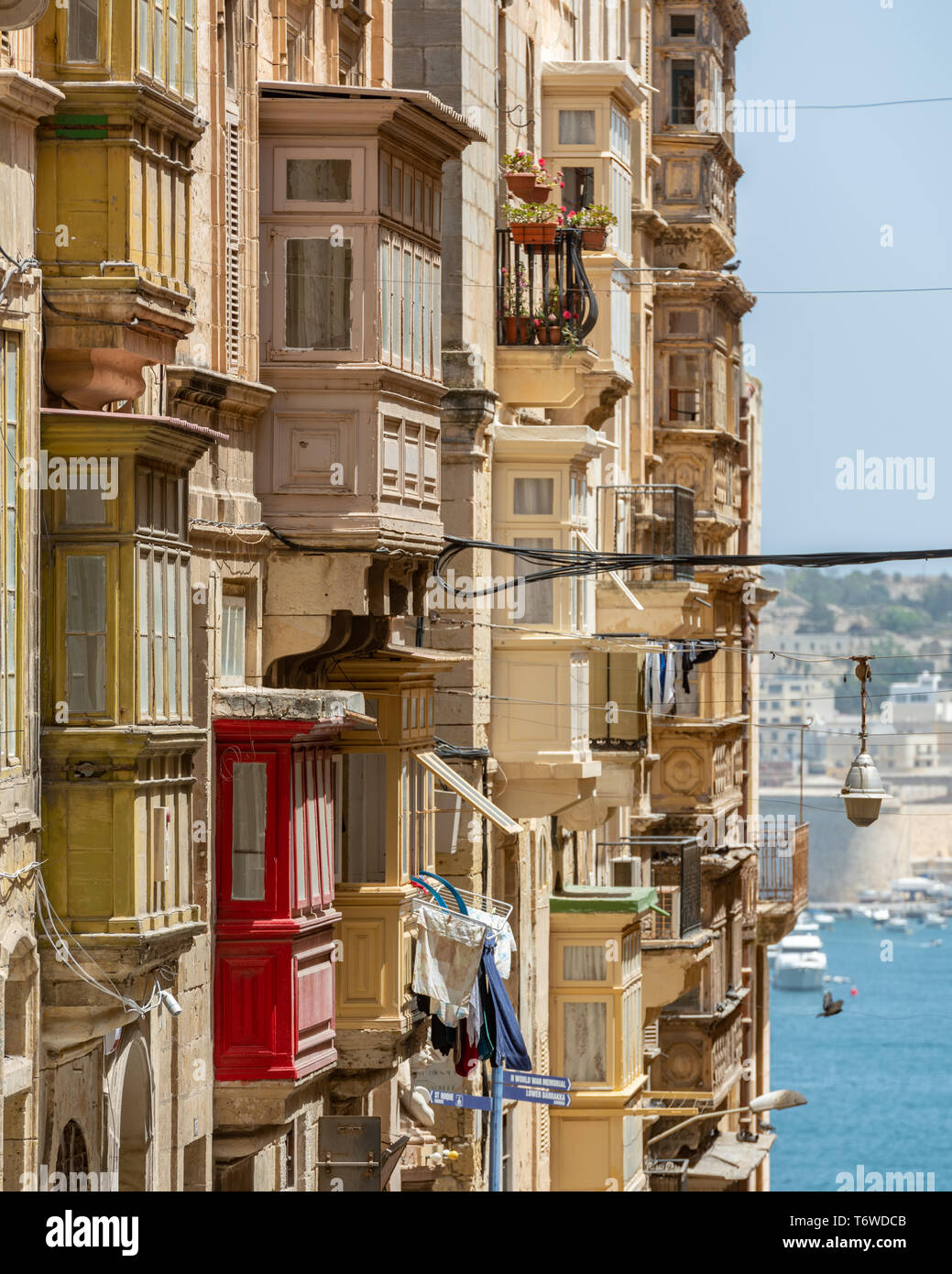 Traditional Maltese houses in Valletta with their vibrant, enclosed ...