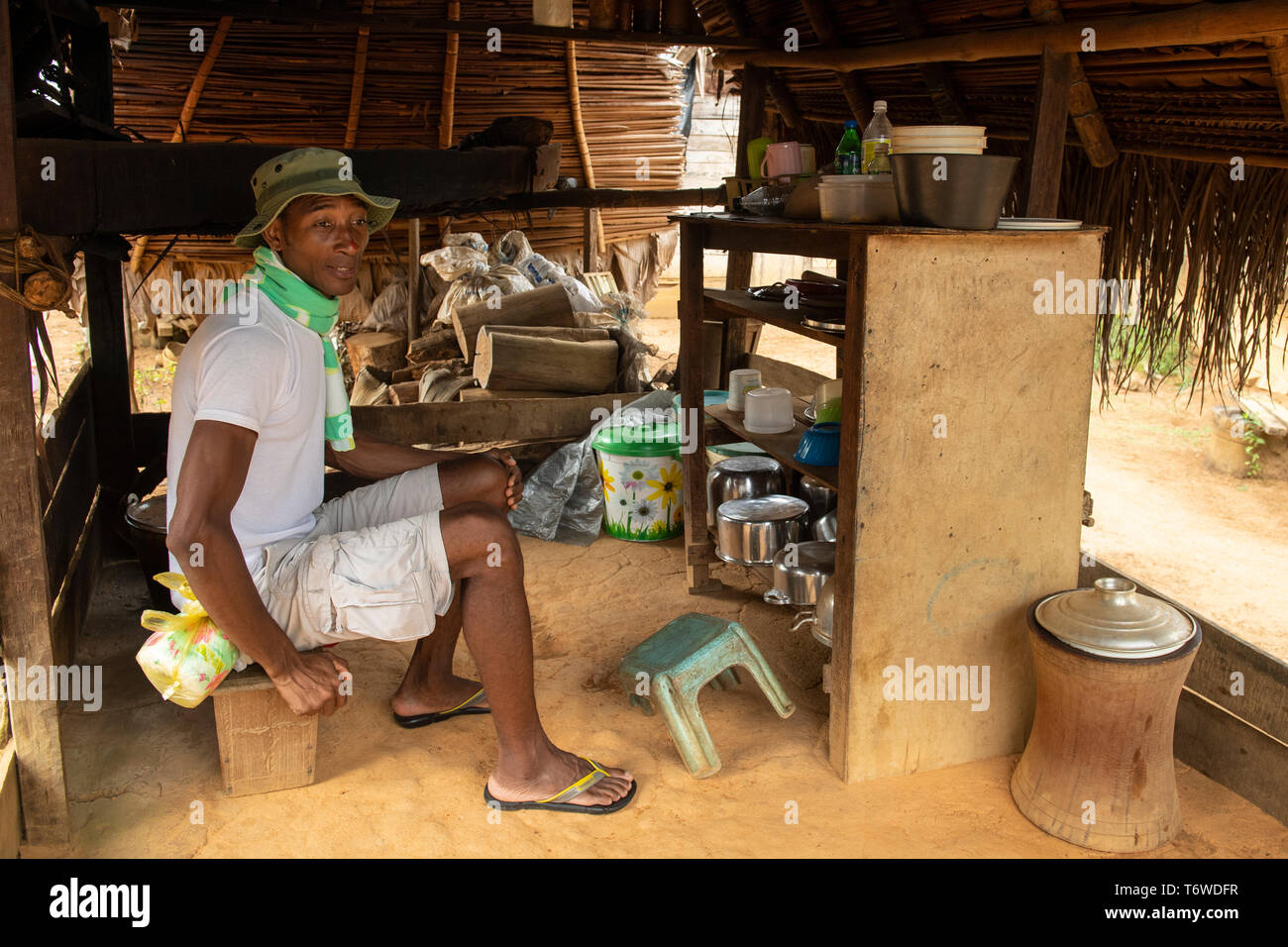 Man in Maroon kitchen, Dan village, Upper Suriname River, Suriname ...