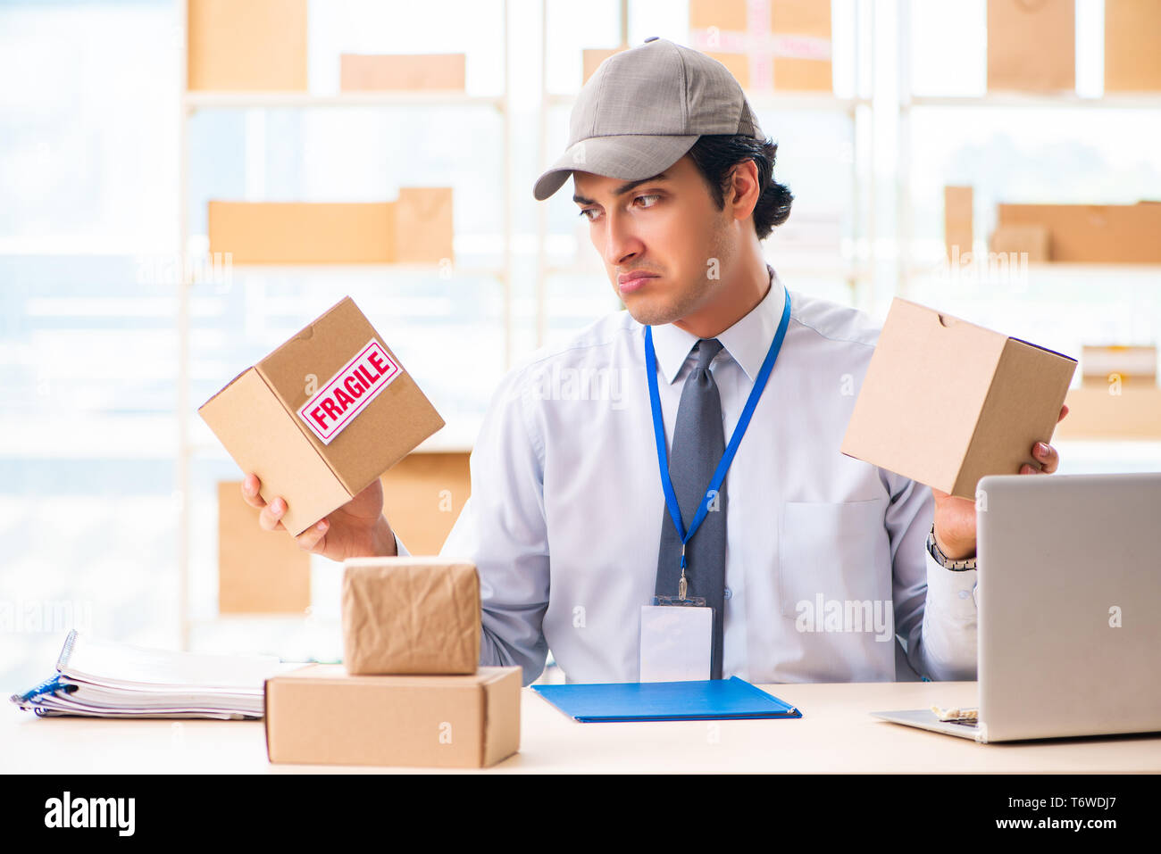 Male employee working in box delivery relocation service Stock Photo ...