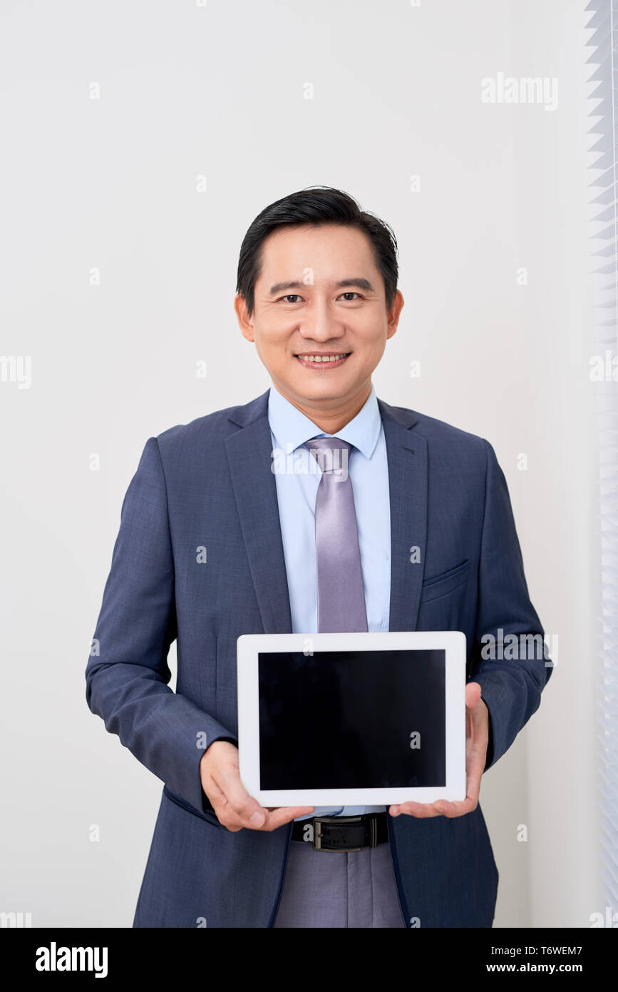Product presentation. Promotion. Business man holding in hands tablet ...