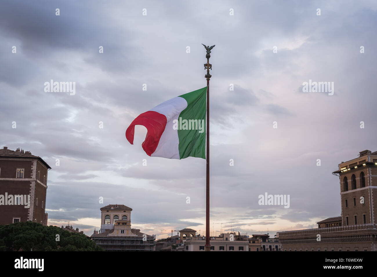 Italian flag floating on the monument Vittorio Emanuele II in Rome ...